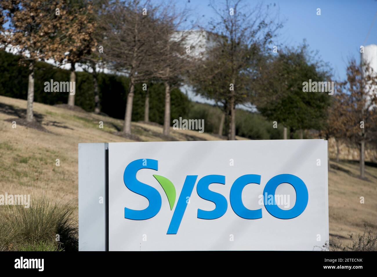 A logo sign outside of a facility occupied by the Sysco Corporation in ...