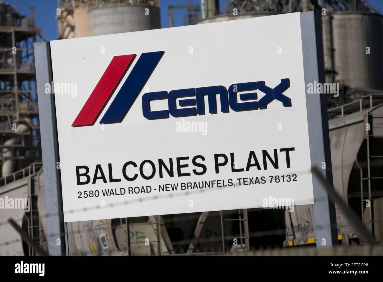 A logo sign outside of a facility occupied by Cemex in New Braunfels ...