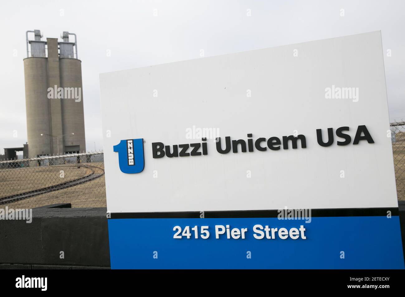 A logo sign outside of a facility occupied by Buzzi Unicem USA in ...