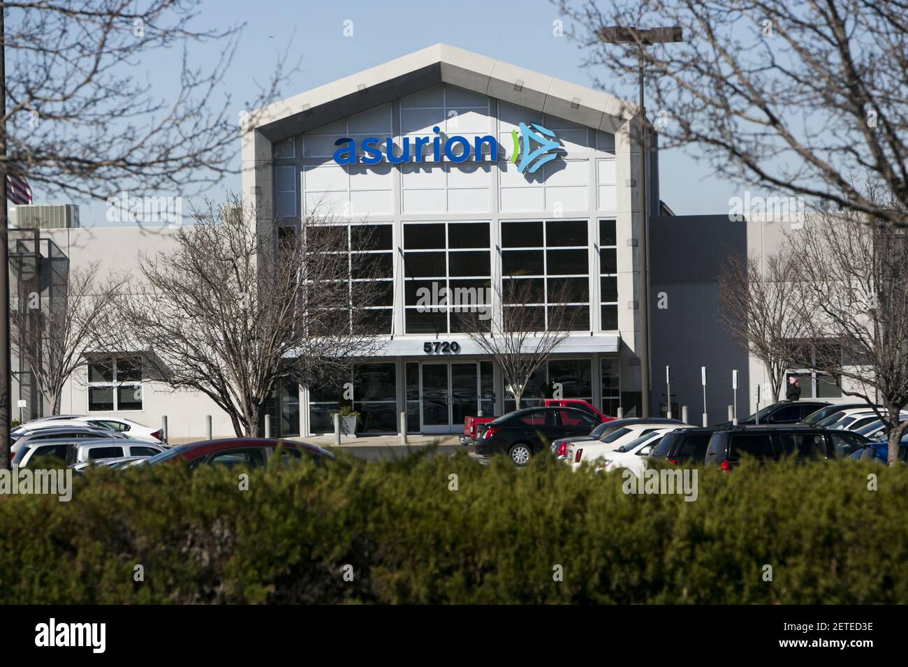 A logo sign outside of a facility occupied by Asurion in La Vergne ...