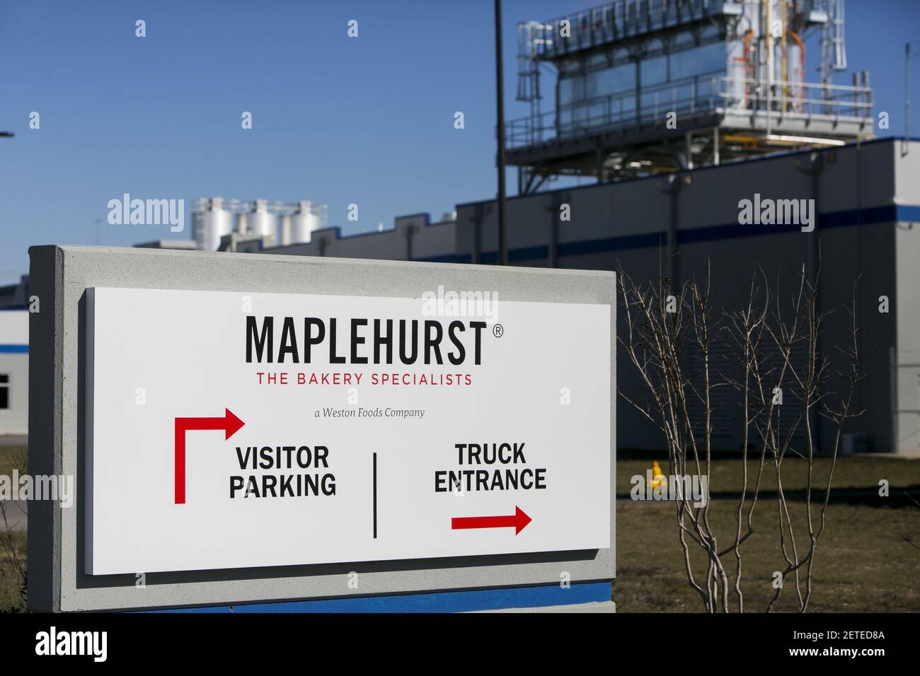 A logo sign outside of a facility occupied by Maplehurst Bakeries in ...