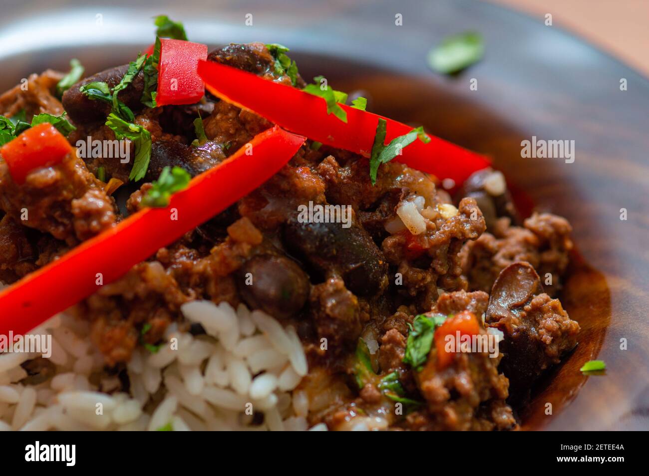 Chili Con Carne with wild rice and red pepper Stock Photo - Alamy