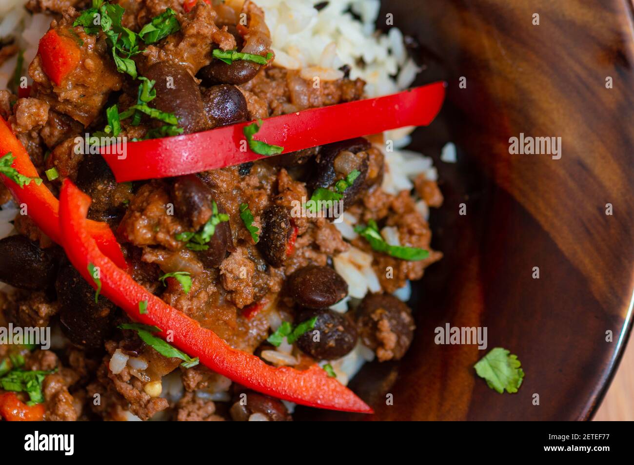 Chili Con Carne with wild rice and red pepper Stock Photo - Alamy