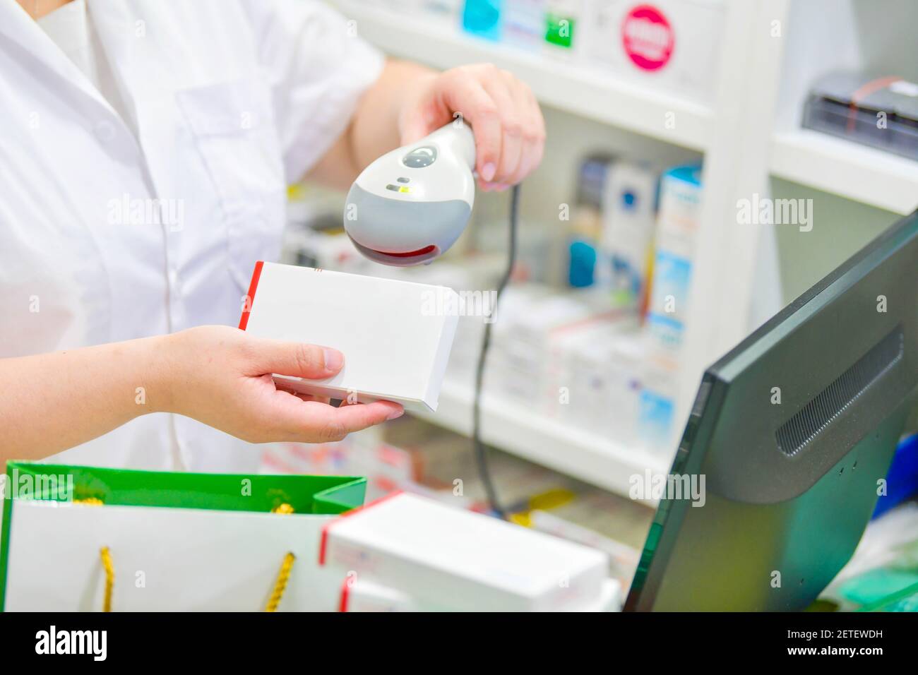Pharmacist scanning barcode of medicine drug in a pharmacy drugstore ...