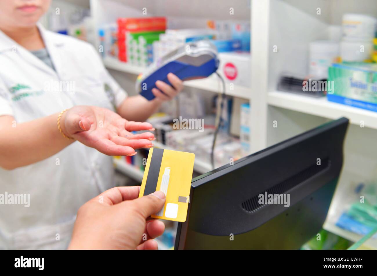 Man paying for Medicaments with credit card in pharmacy drugstore Stock ...