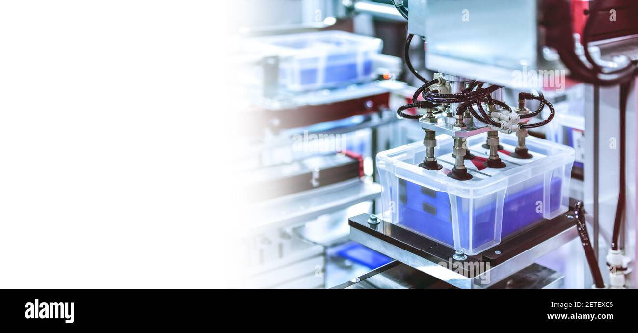 Automated storage warehouse with white plastic in production line ...