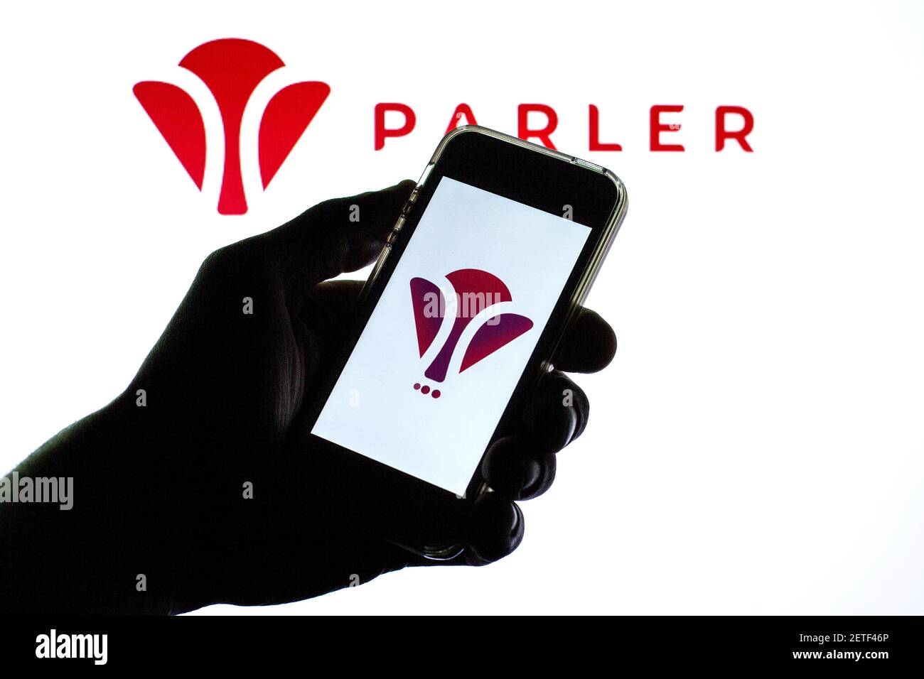 In this photo illustration a new Parler logo and is seen displayed on a ...