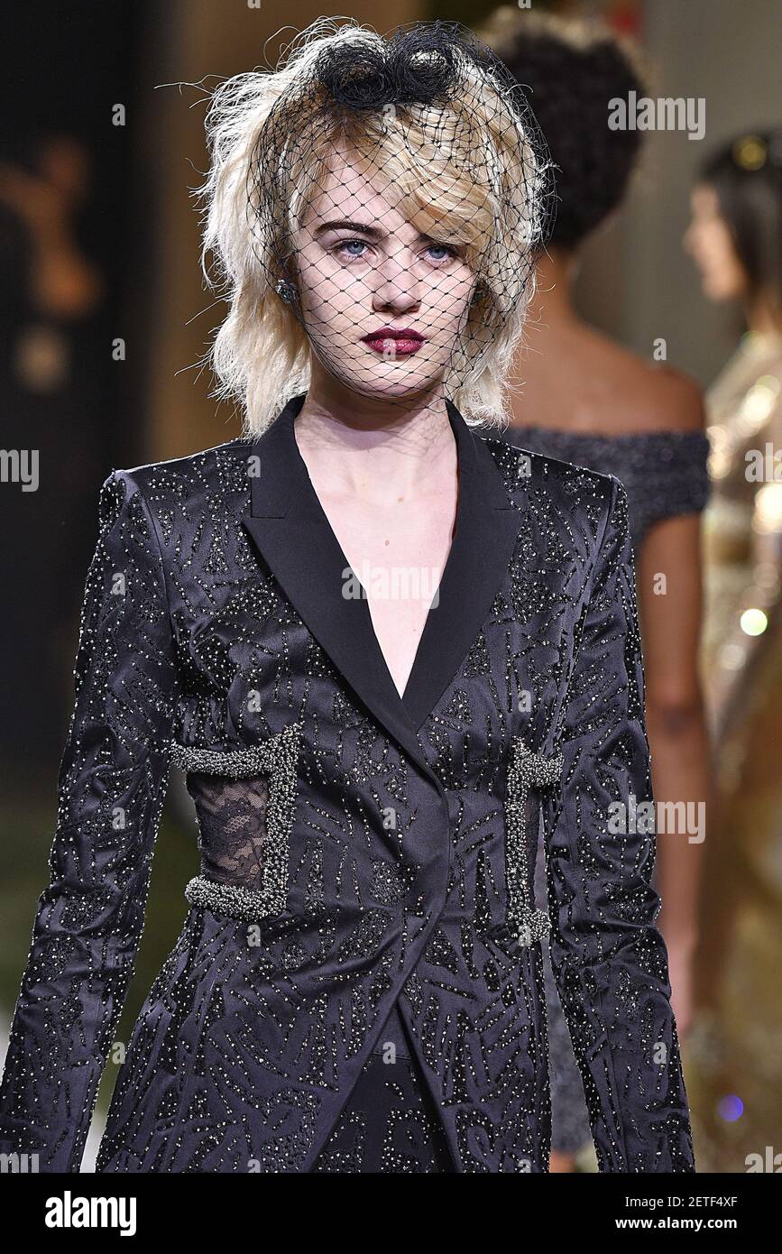 Model Celine Bouly walks on the runway during the La Perla Fashion Show ...