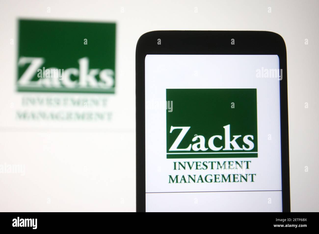 In this photo illustration a Zacks investment management logo is seen ...