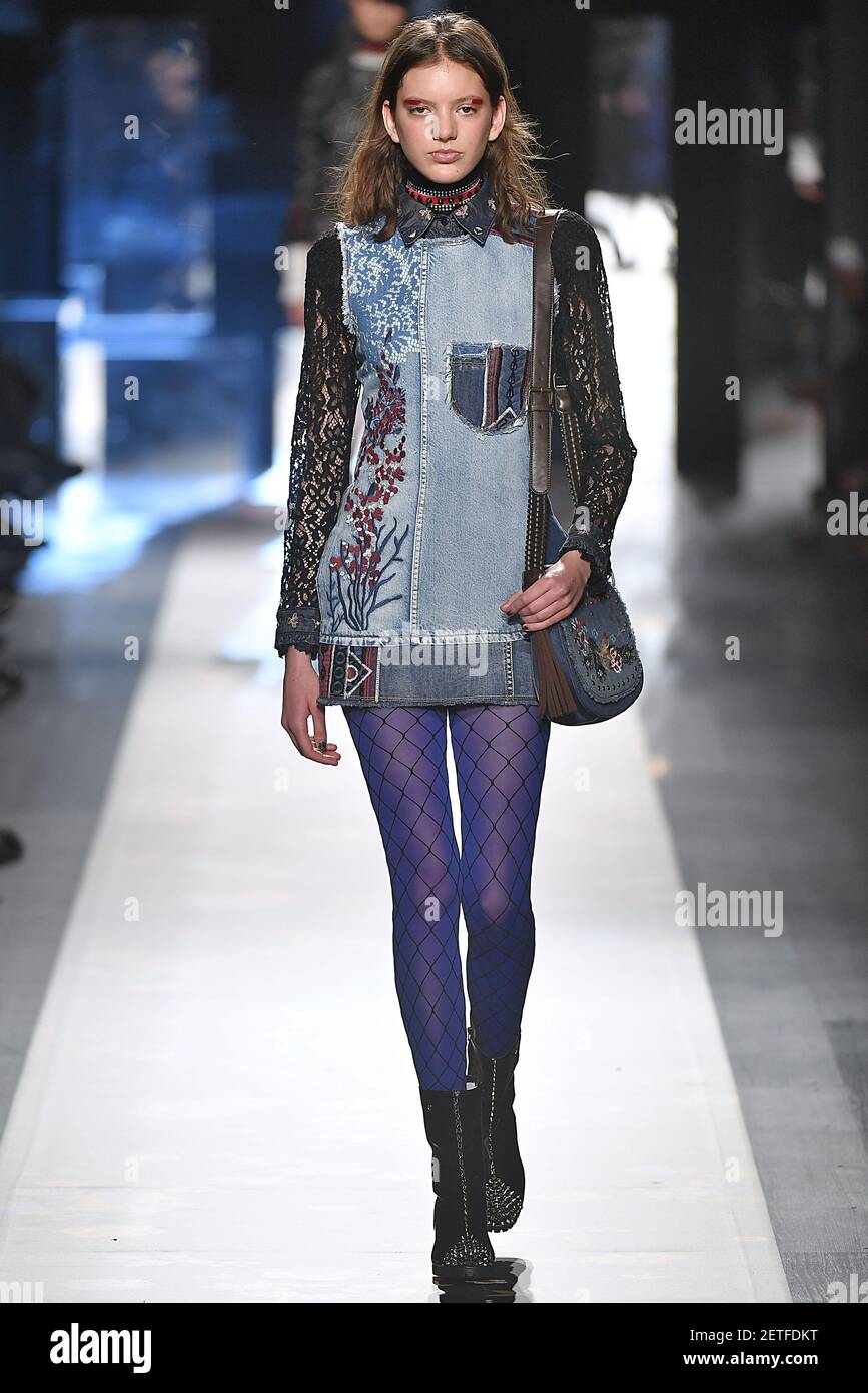 Model walks on the runway during the Desigual Fashion Show at FW17 held ...