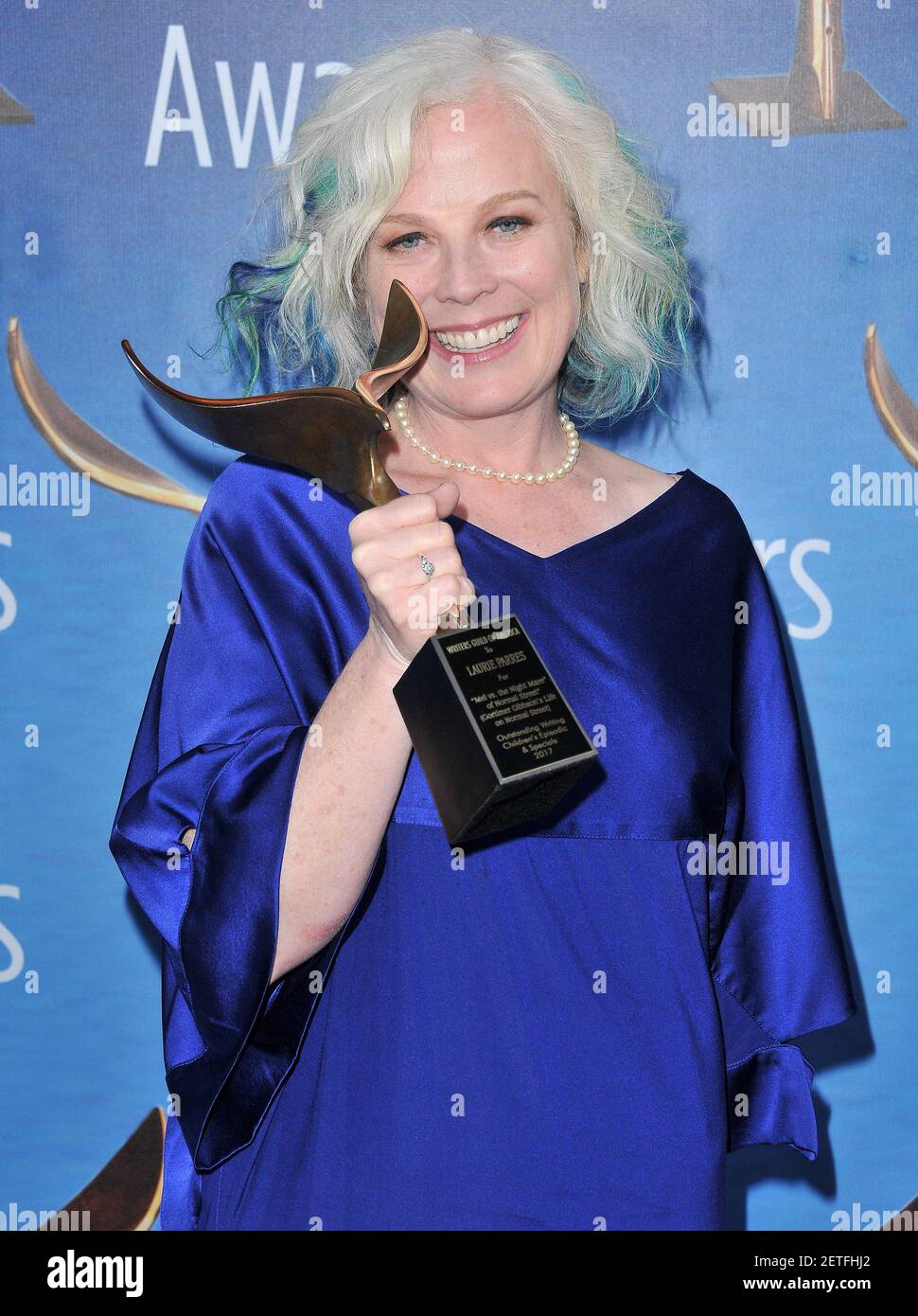 Laurie Parres with her award at the 2017 Writers Guild Awards L.A ...