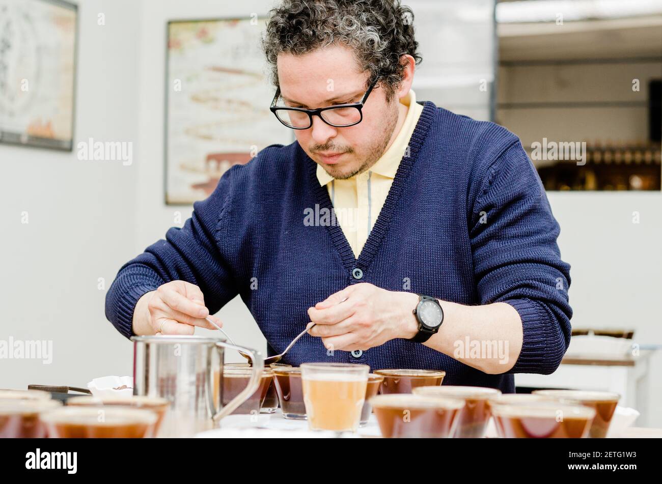 Professional barista testing the taste of a new coffee Stock Photo - Alamy
