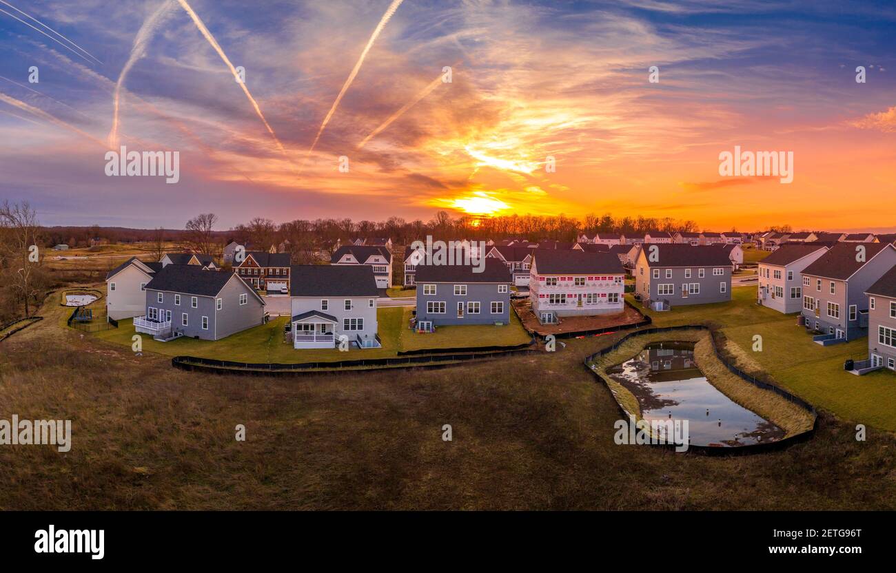 Aerial view of upper class American neighborhood street with dramatic ...