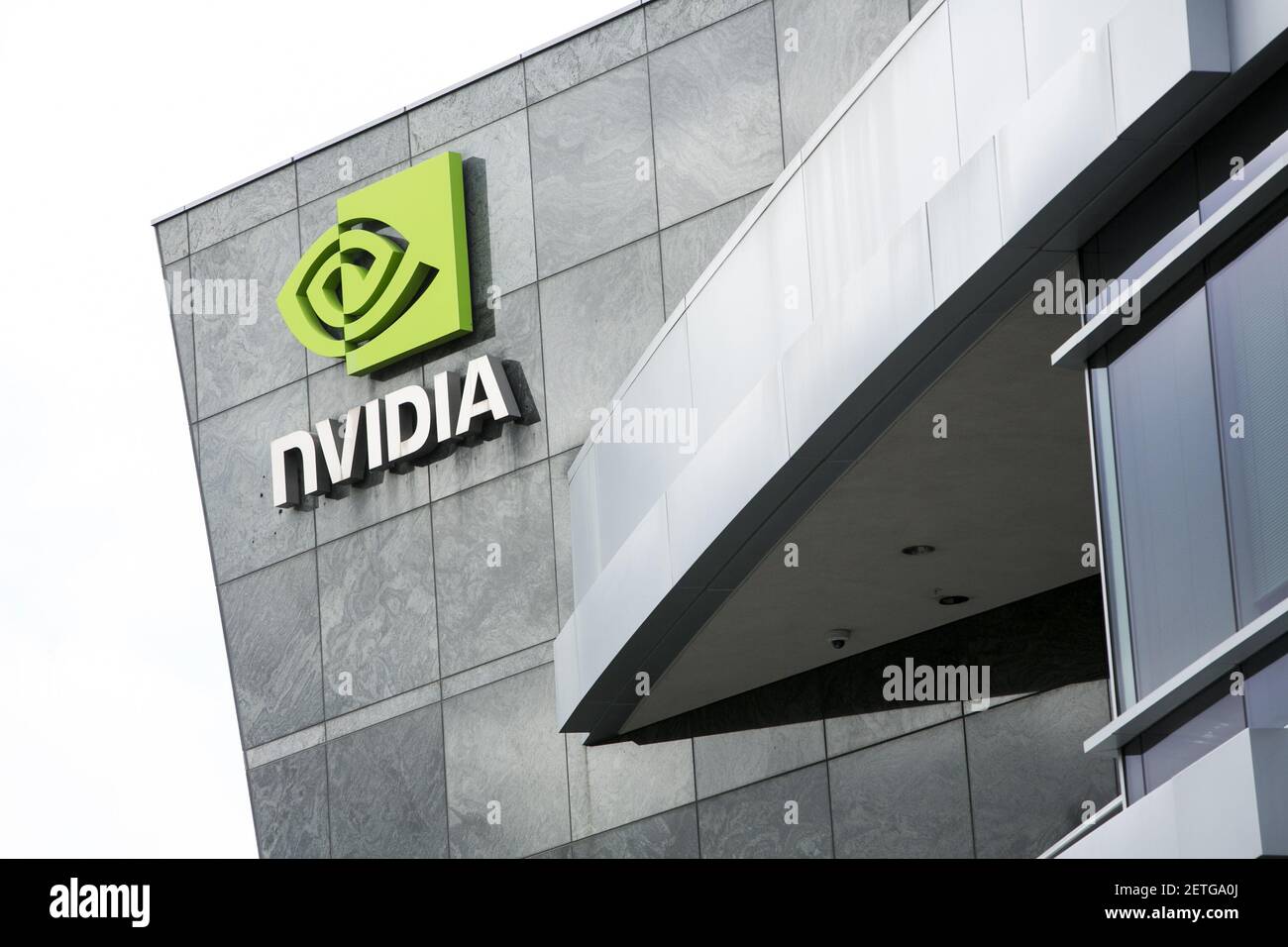 A logo sign outside of the headquarters of the Nvidia Corporation in ...