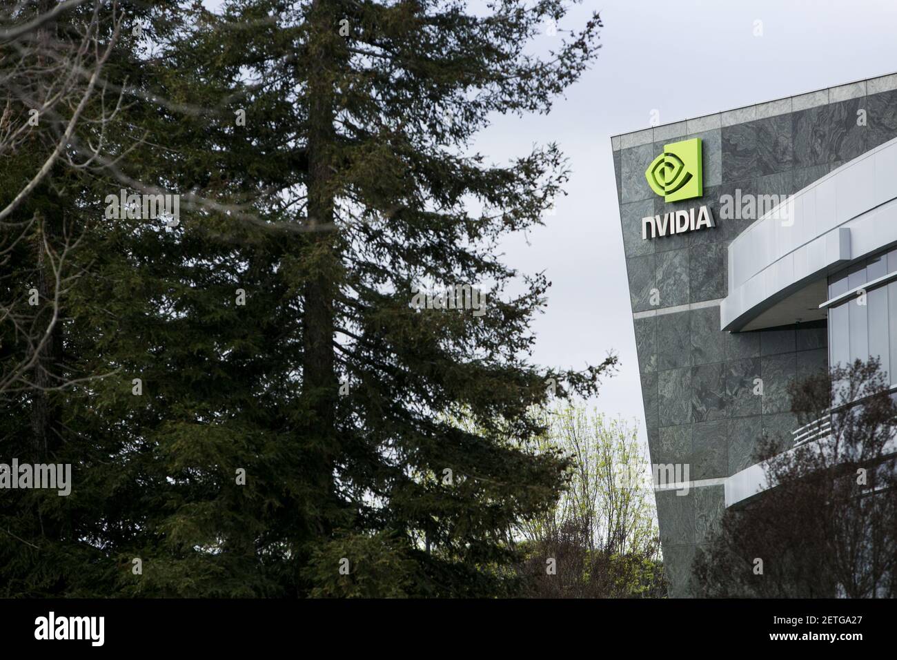 A logo sign outside of the headquarters of the Nvidia Corporation in ...