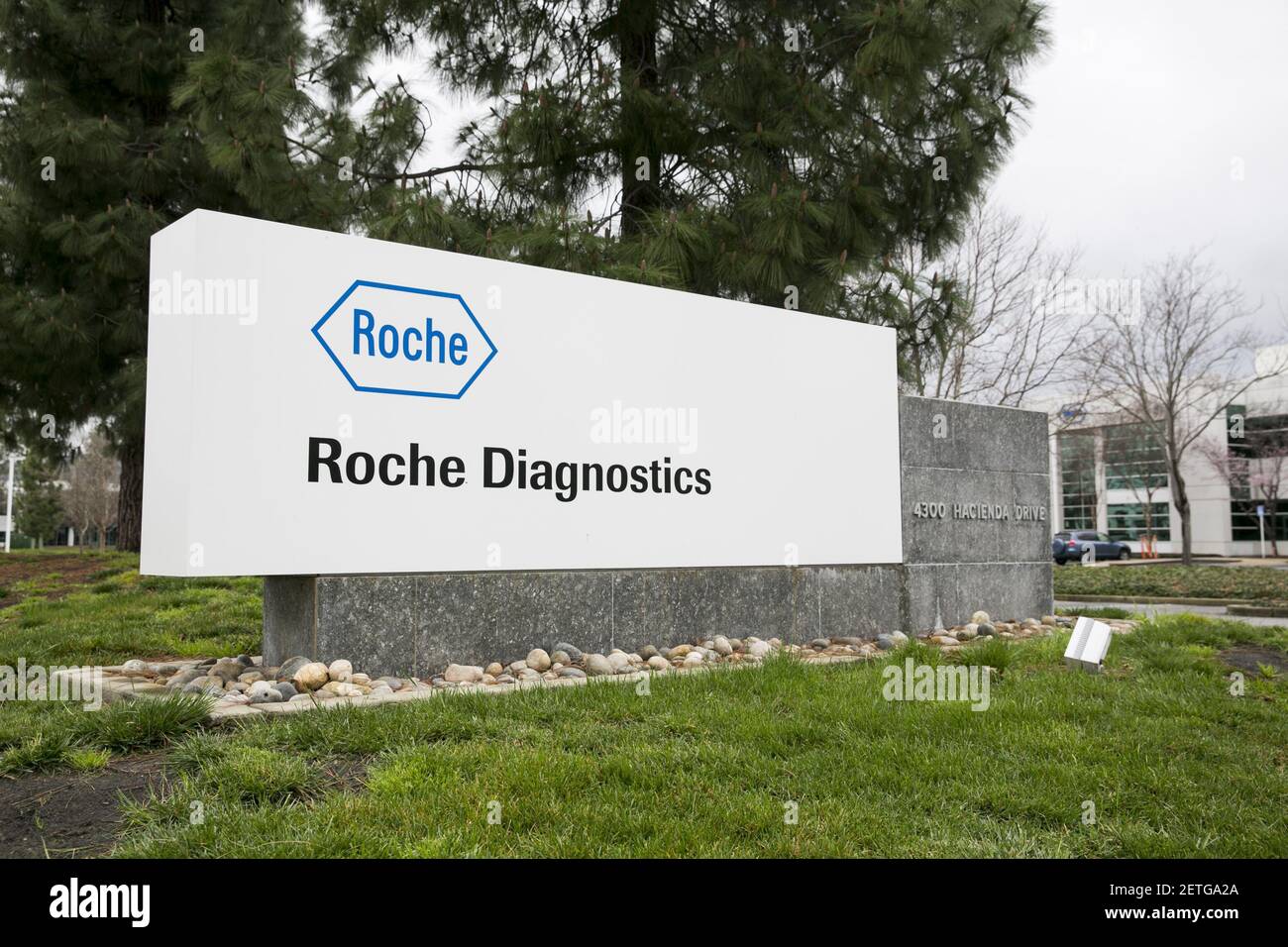 A logo sign outside of a facility occupied by Roche Diagnostics in ...