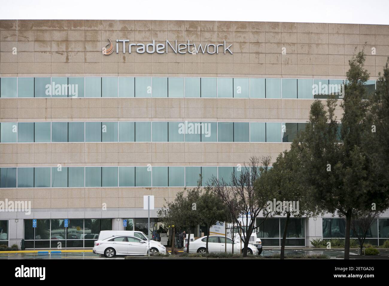 A logo sign outside of the headquarters of iTradeNetwork in Dublin ...