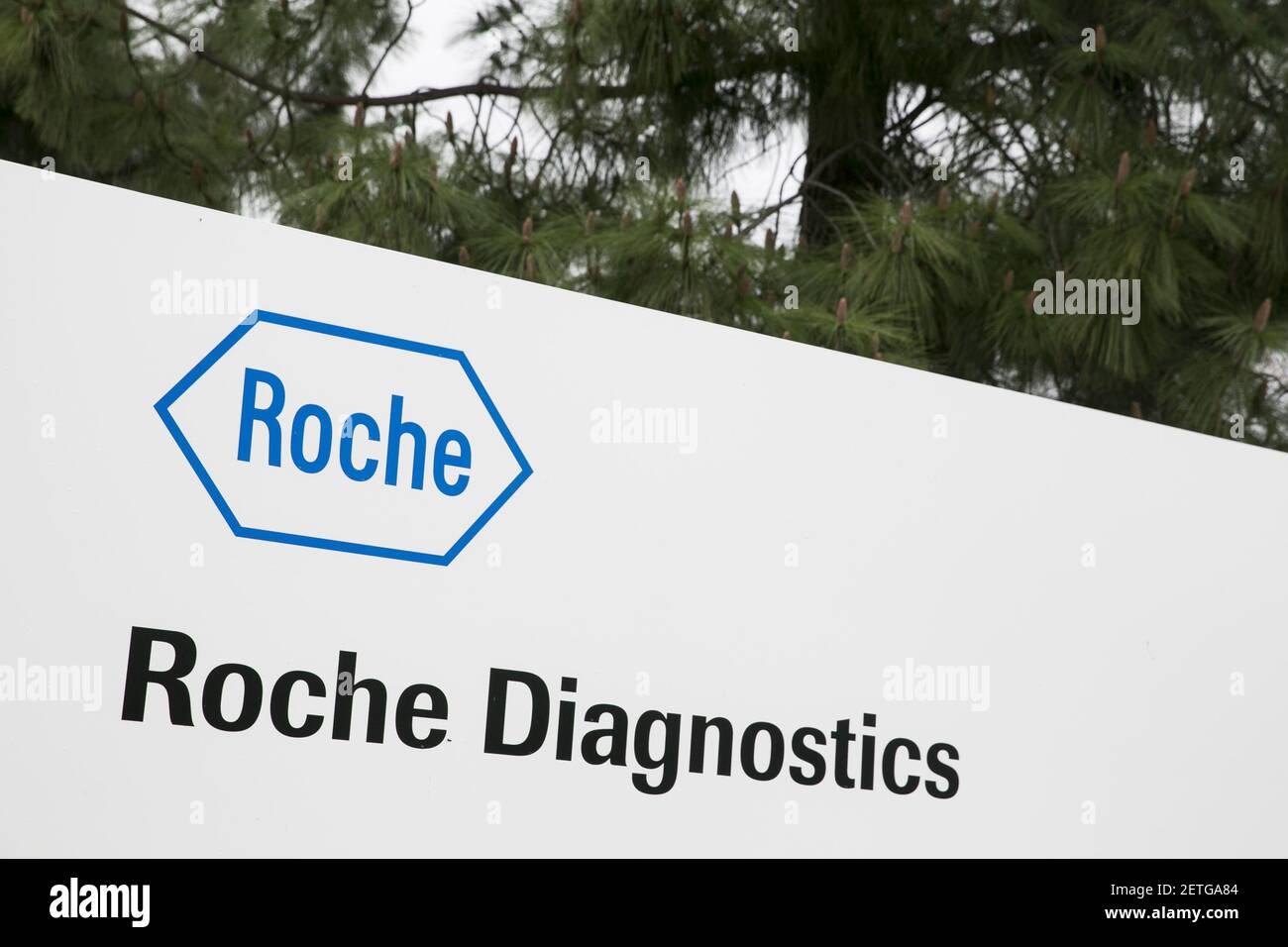 A logo sign outside of a facility occupied by Roche Diagnostics in ...