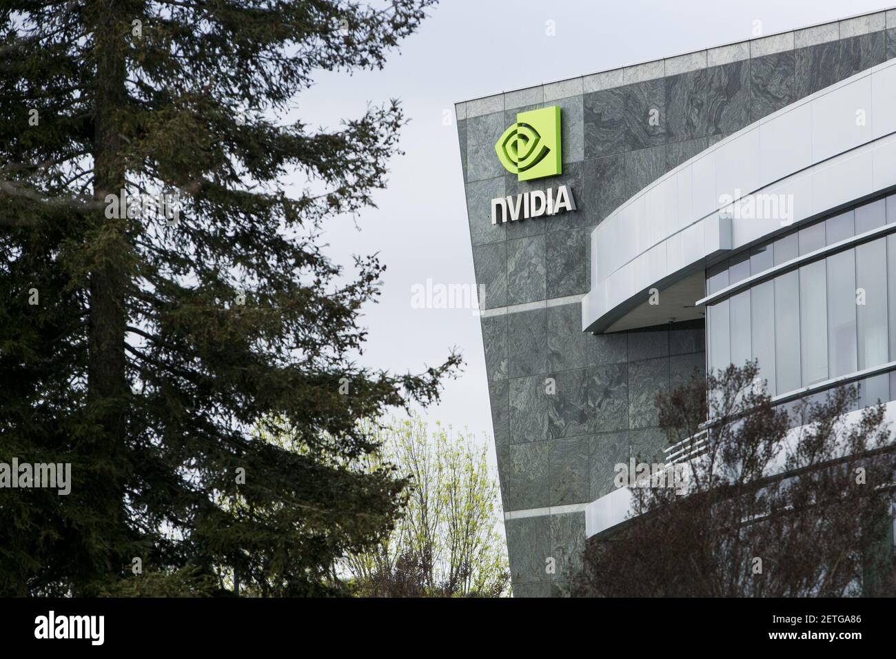A logo sign outside of the headquarters of the Nvidia Corporation in ...