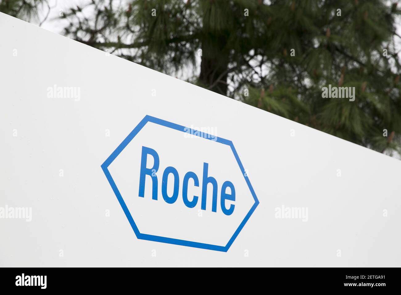 A logo sign outside of a facility occupied by Roche Diagnostics in ...