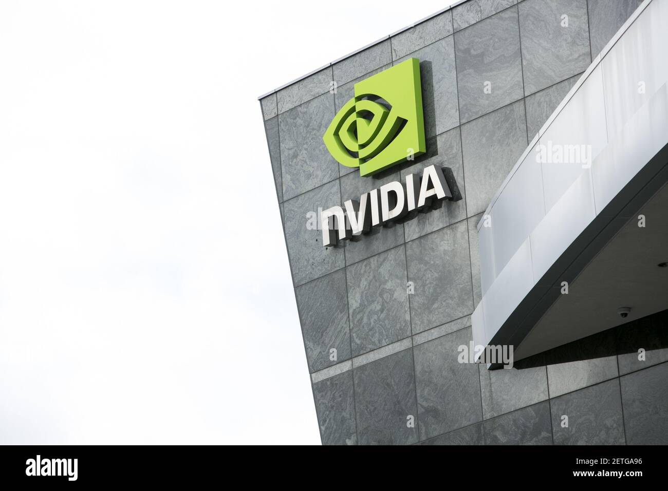 A logo sign outside of the headquarters of the Nvidia Corporation in ...