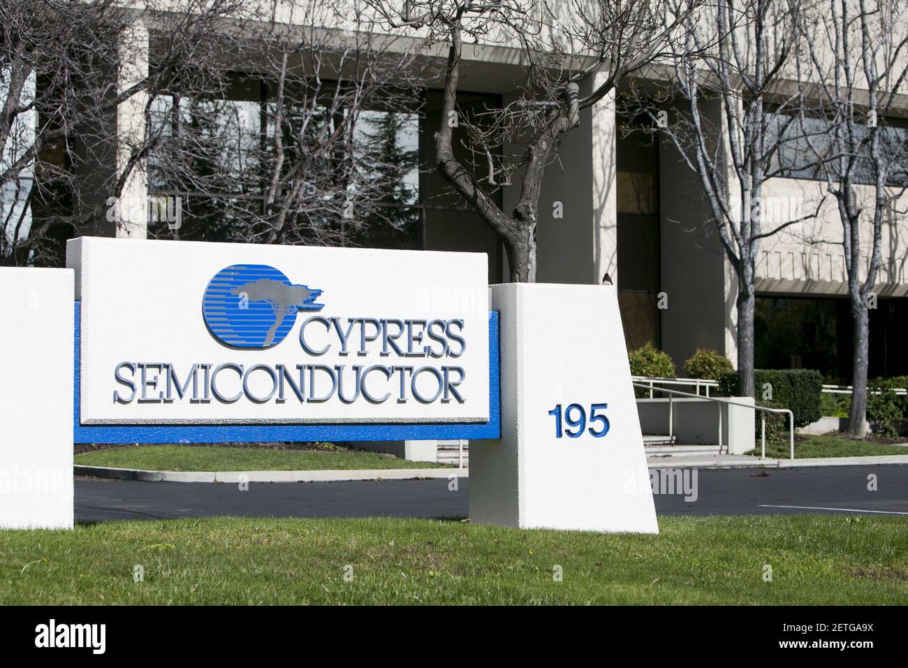 A logo sign outside of the headquarters of Cypress Semiconductor in San ...