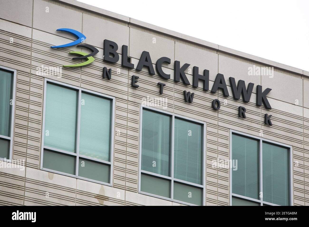 A logo sign outside of the headquarters of Blackhawk Network Holdings ...