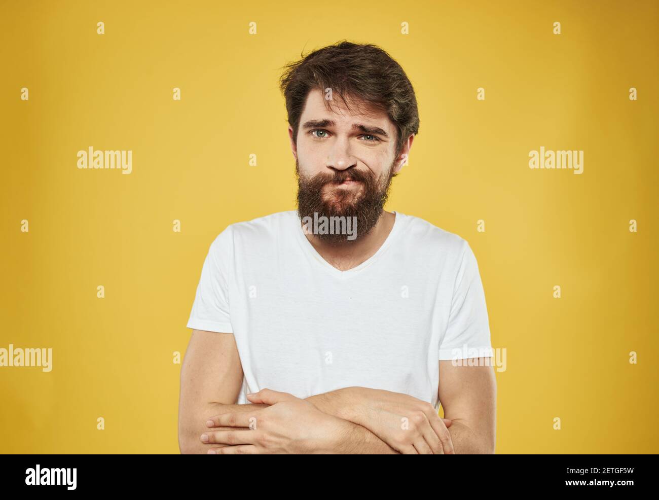 Emotional man with thick beard grinning model yellow background Stock ...