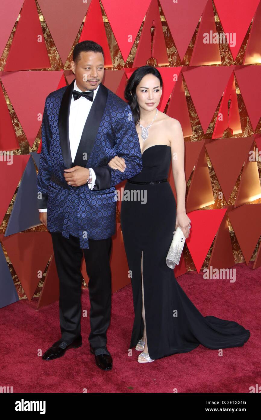 Mira Pak and Terrence Howard walking on the red carpet during the 89th ...