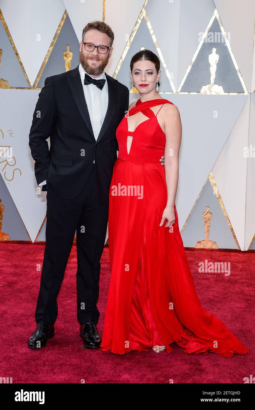 Seth Rogan and Lauren Miller walking the red carpet during the 89th ...