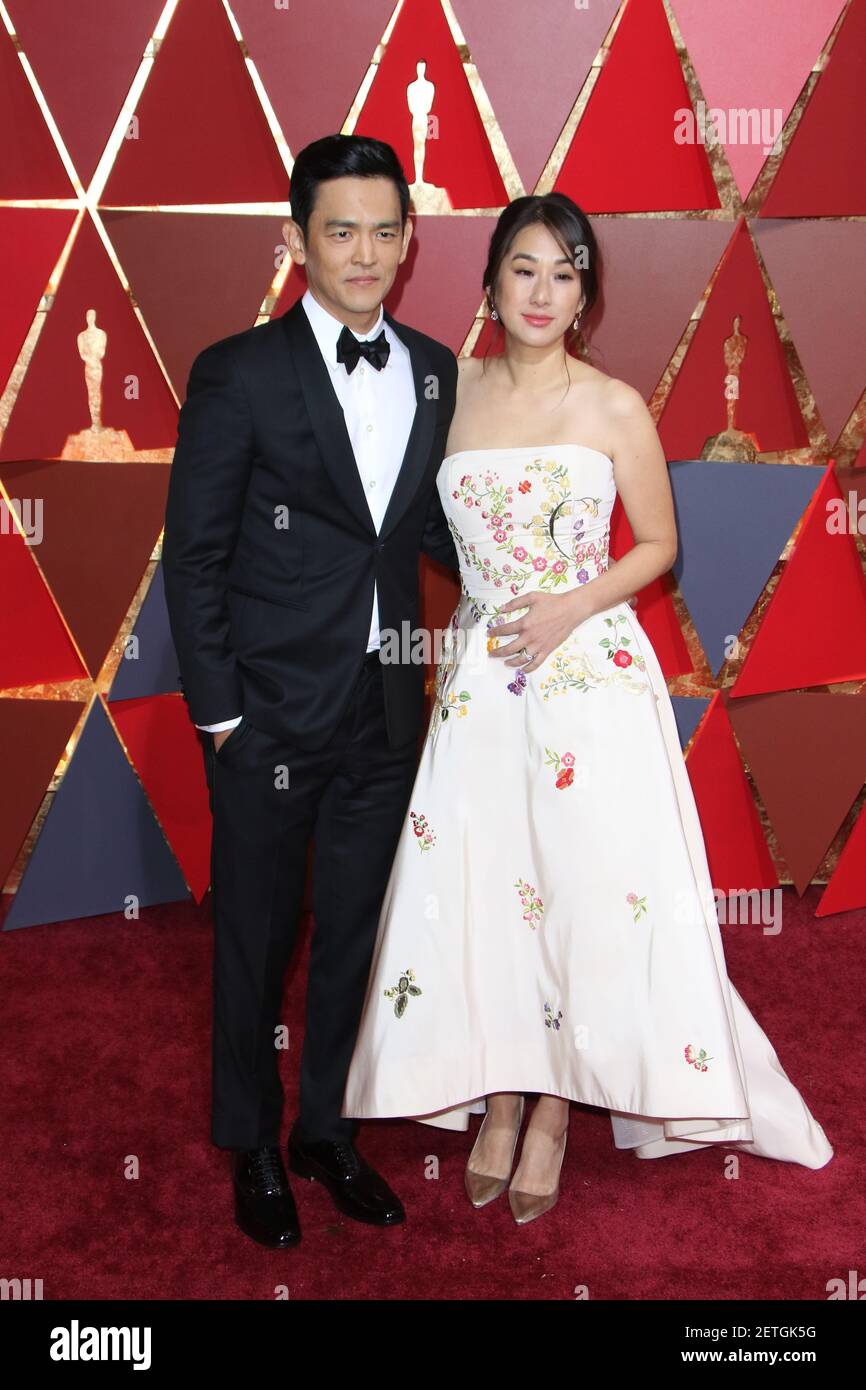 John Cho, Kerri Higuchi walking on the red carpet during the 89th ...