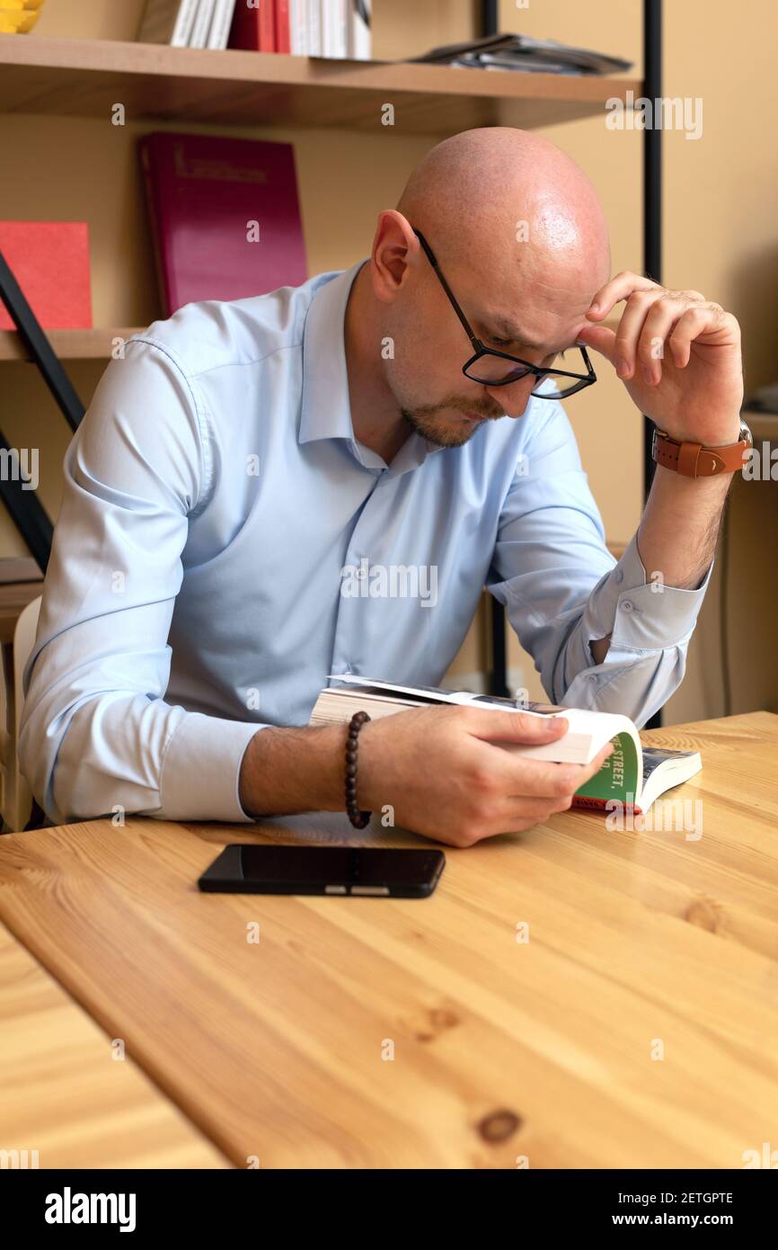 Bearded man reading hi-res stock photography and images - Alamy