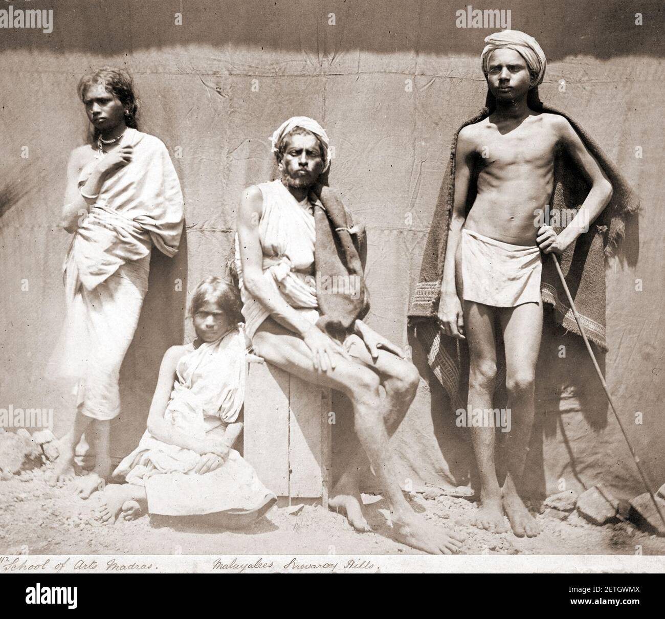 Photograph of two men and two women of the Malaiyali tribe in the ...
