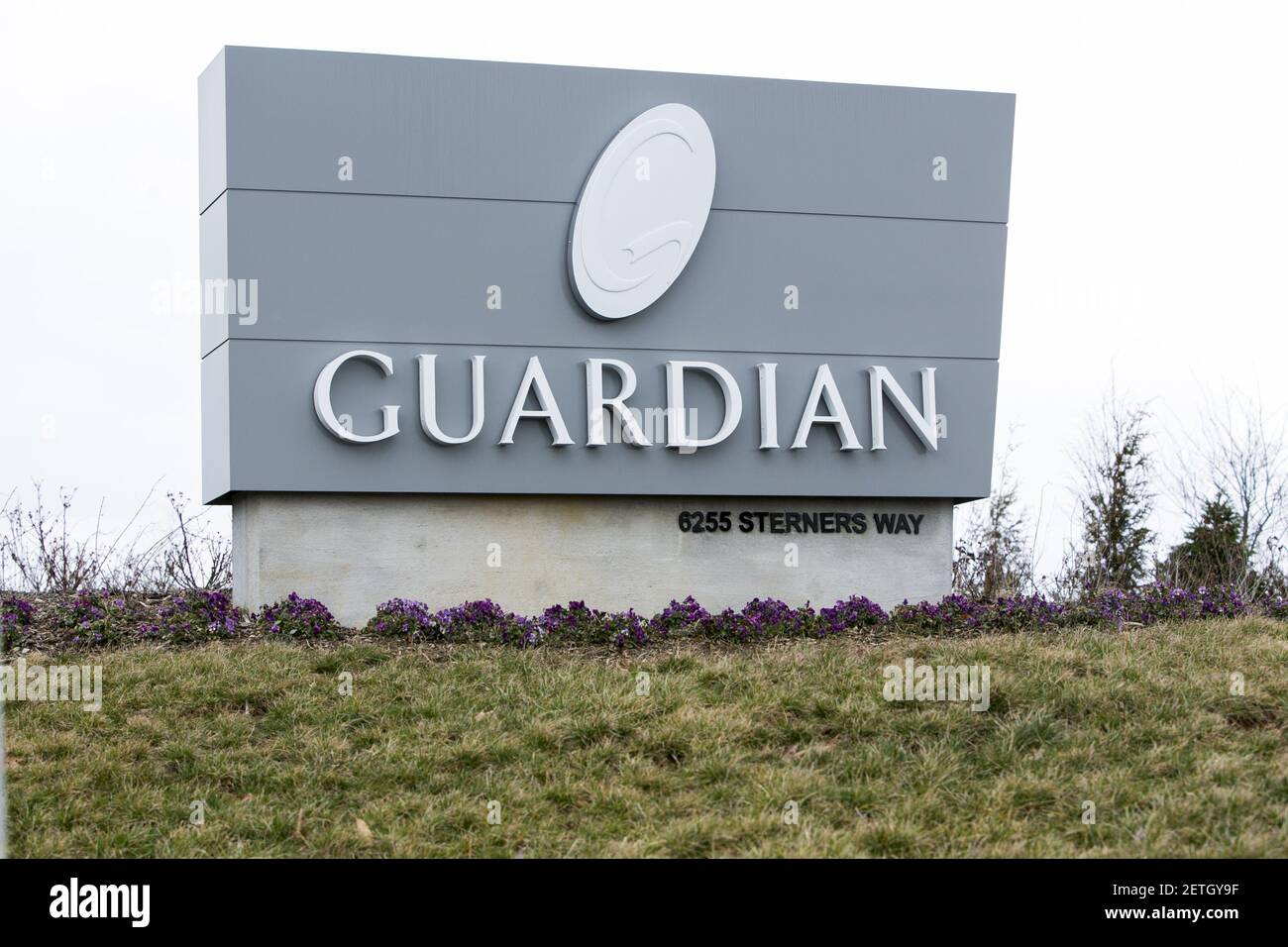 A logo sign outside of a facility occupied by The Guardian Life ...