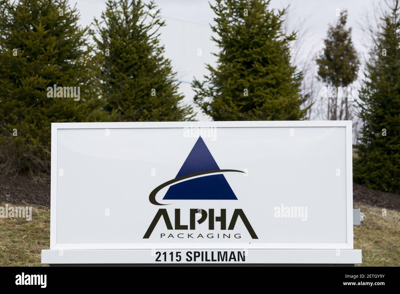 A logo sign outside of a facility occupied by Alpha Packaging in ...