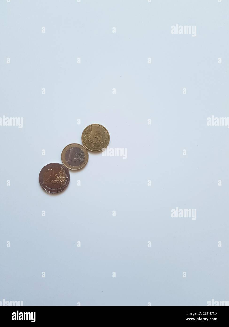 Euro coins on a white background. Background with copyspace Stock Photo ...