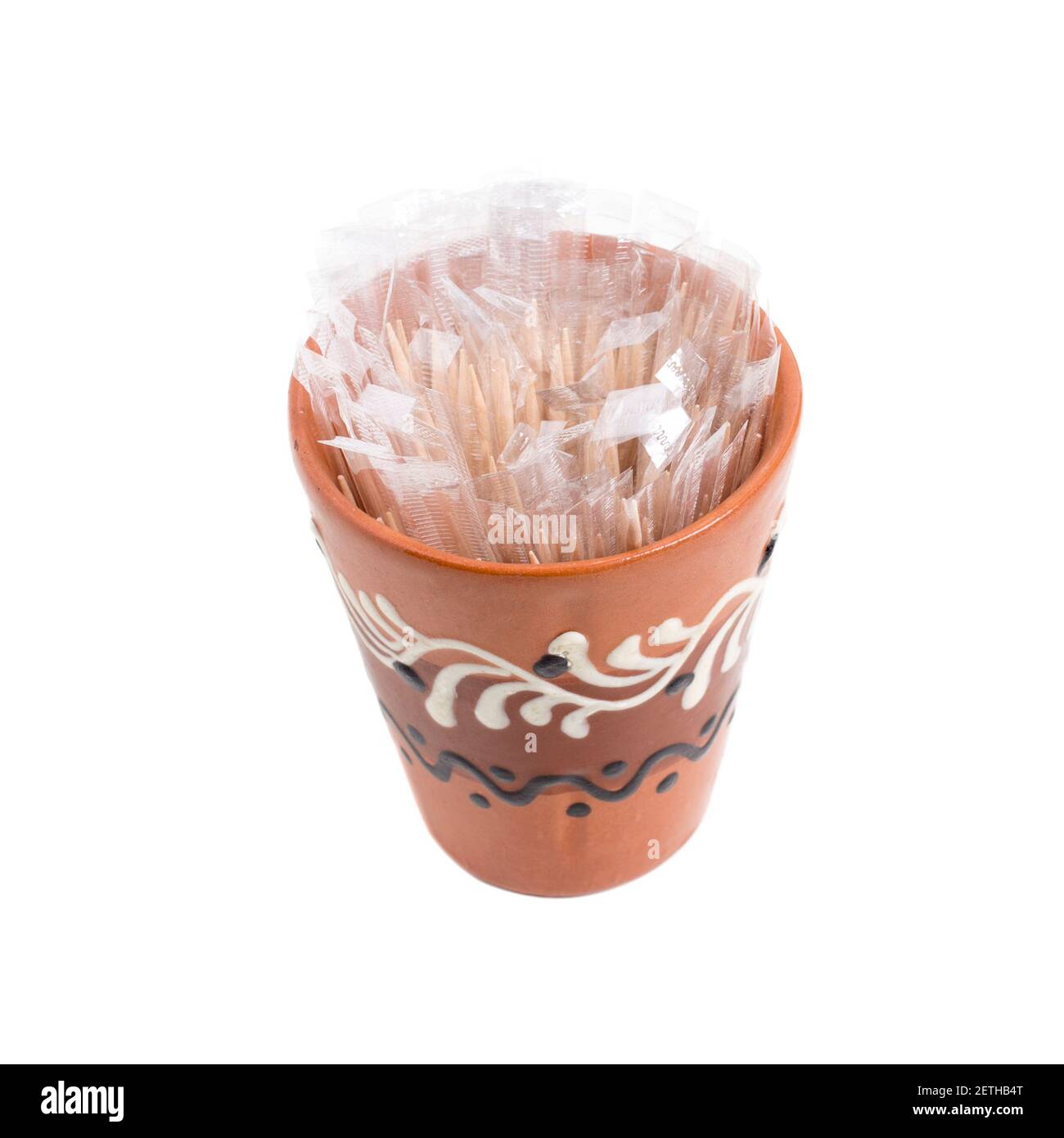 Clay painted cup with wooden toothpicks. Isolated on a white background ...