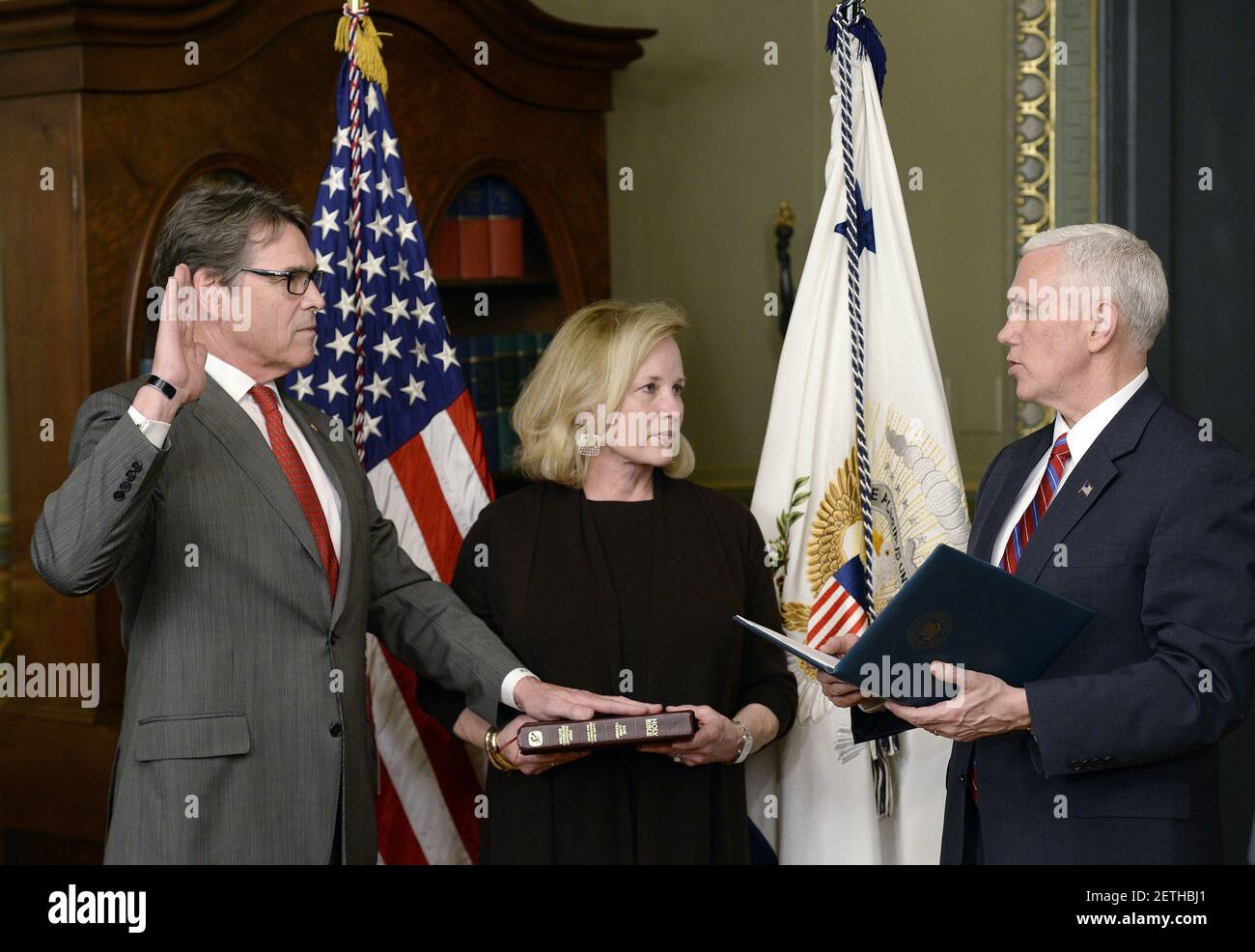 Rick Perry (L) is sworn in to be States Secretary of Energy by Vice ...