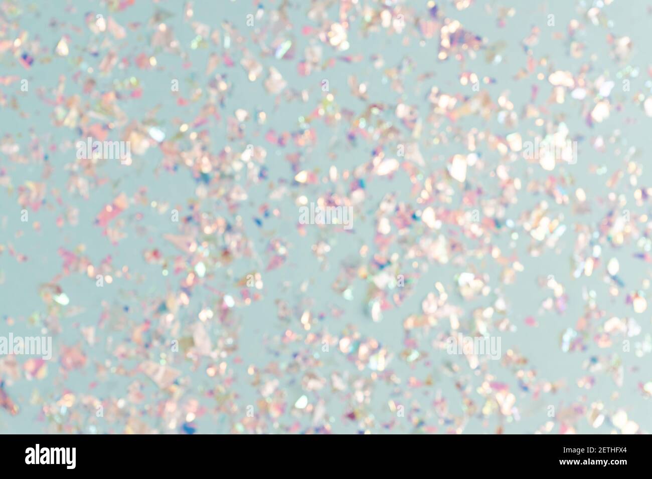 pearl confetti sparkles on blue holiday background. Festive backdrop or ...