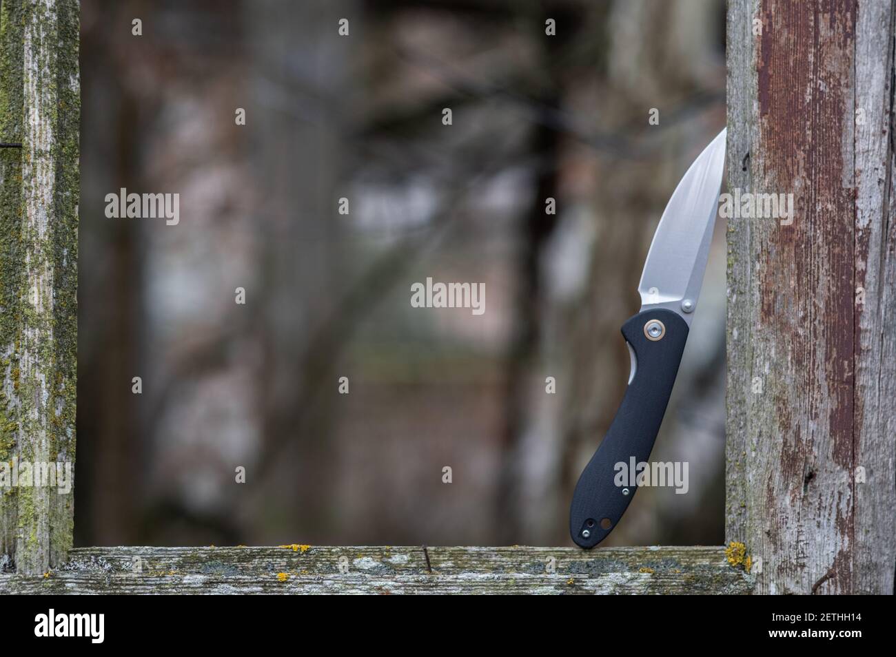 Photo of a knife on the street in a window opening. Knife on an old ...