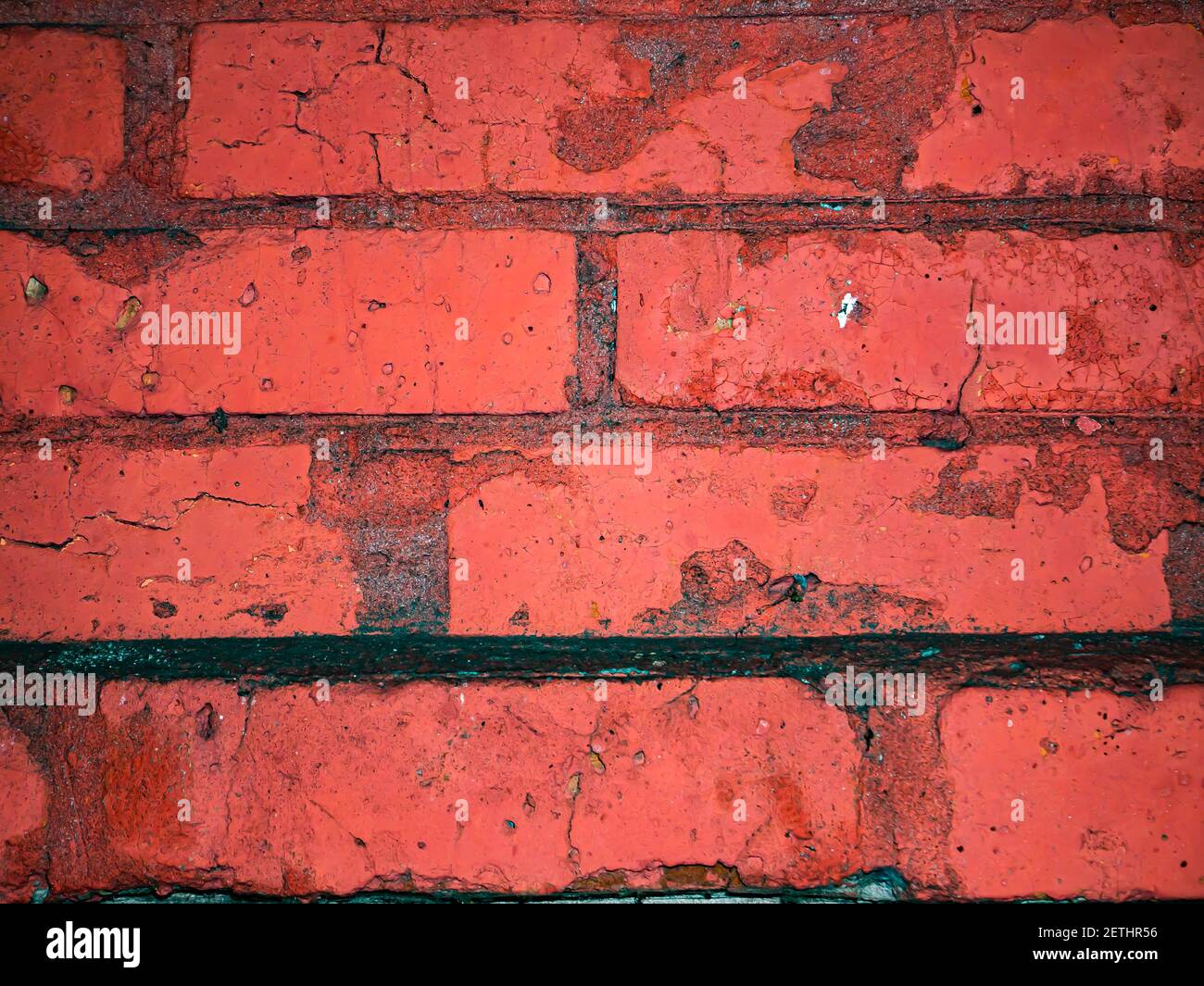 The texture of a brick wall painted in red. Brick wall. Red paint ...
