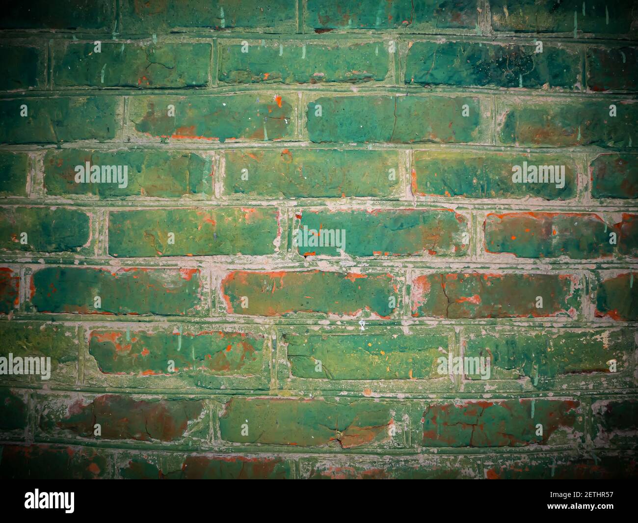 The texture of a brick wall painted in green. Brick wall. Green paint ...
