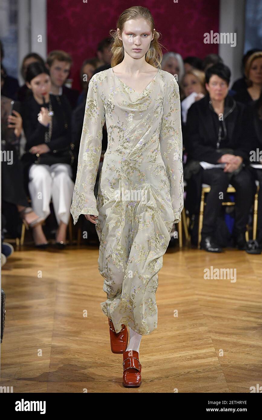 Model Jess PW walks on the runway during the John Galliano Fashion Show ...