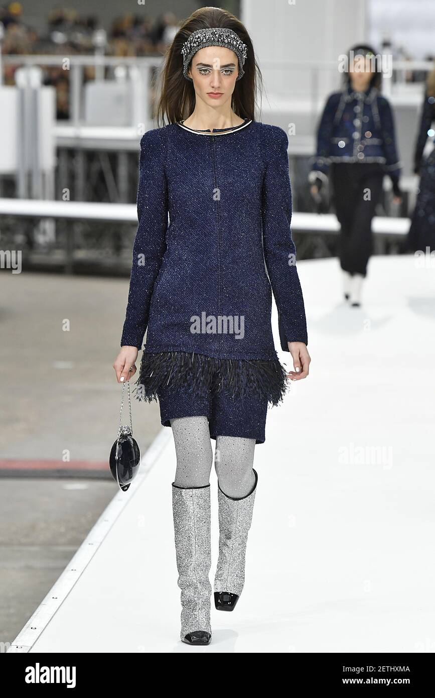 Model Amanda Googe walks on the runway during the Chanel Fashion Show ...