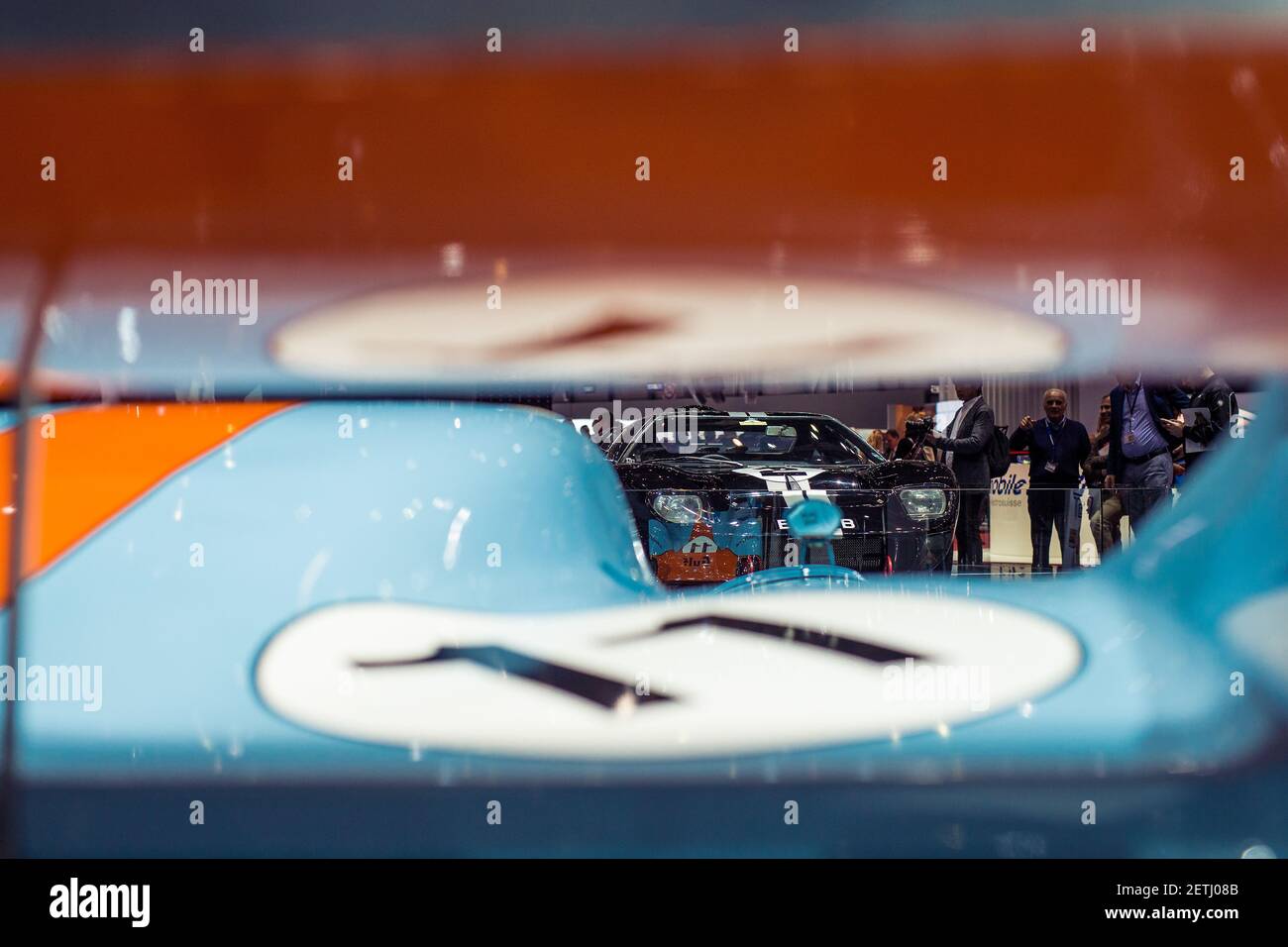Ford GT40 is seen thru the wings of a car at the Motor Show in Geneva ...