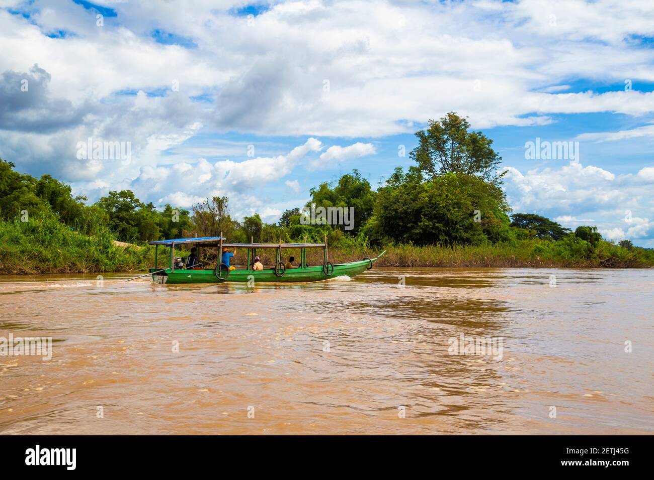 The taxi boat takes passengers from mainland to Don Det island in ...