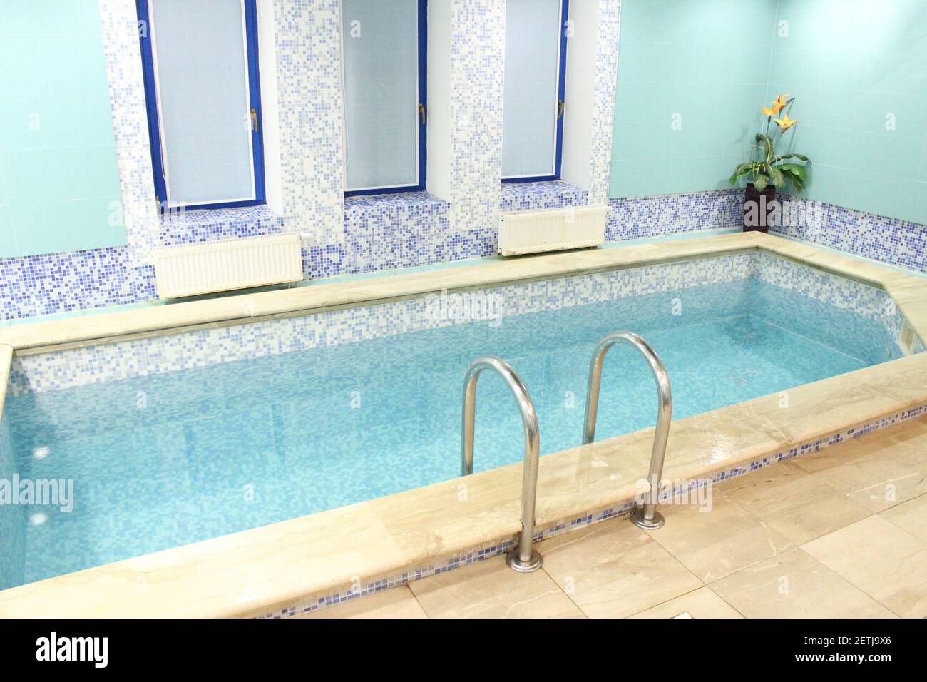 View of the indoor swimming pool in the sauna Stock Photo - Alamy