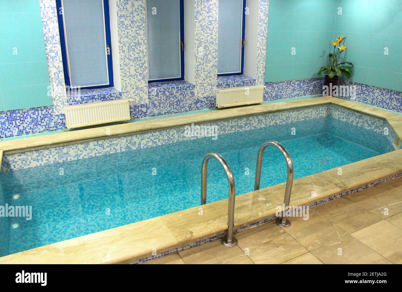 View of the indoor swimming pool in the sauna Stock Photo - Alamy
