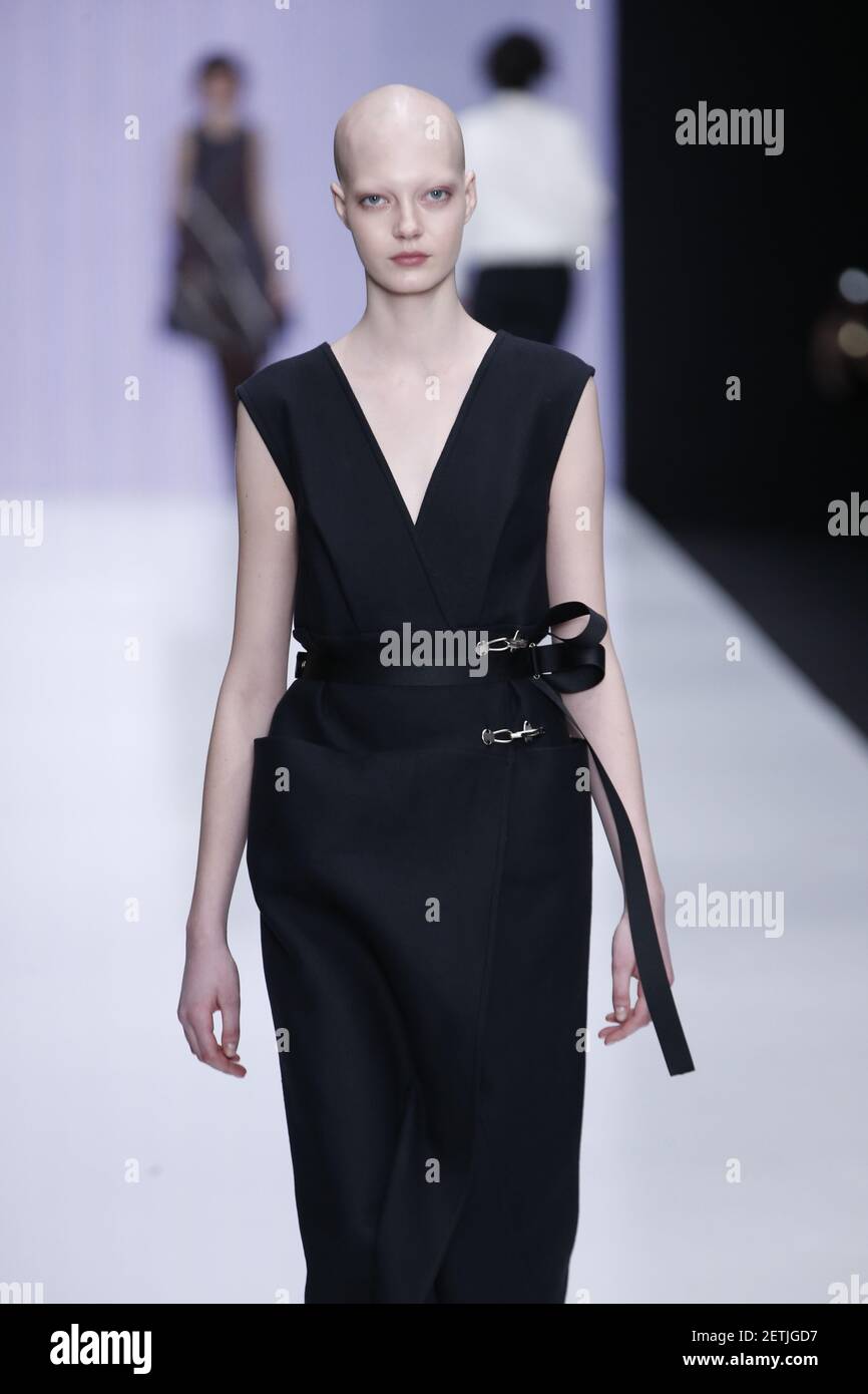 A model walks on the runway during the Yulia Nikolaeva Fashion Show at ...