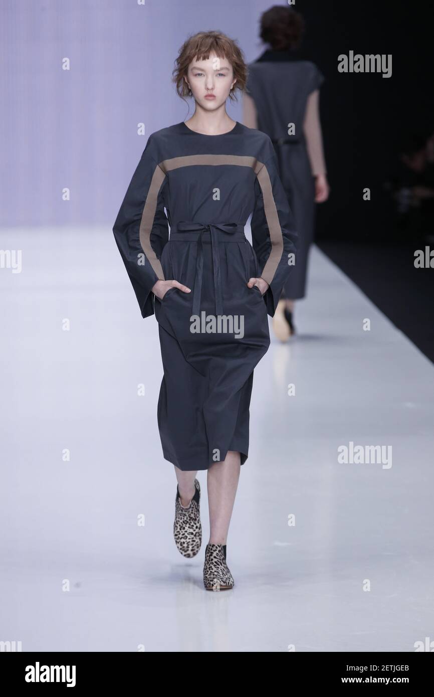 A model walks on the runway during the Yulia Nikolaeva Fashion Show at ...